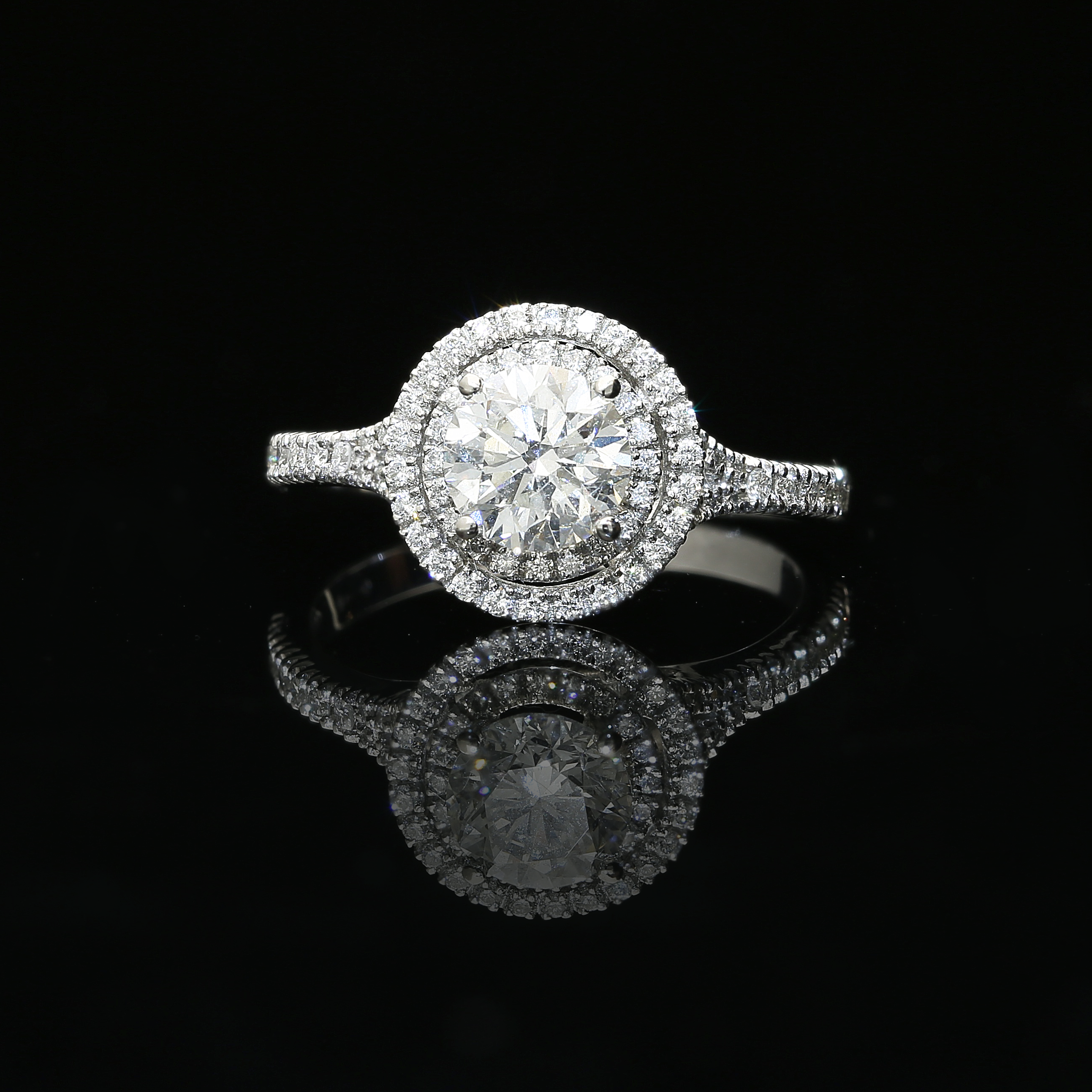 A 1.02ct certified diamond set in a beautiful platinum halo setting ...